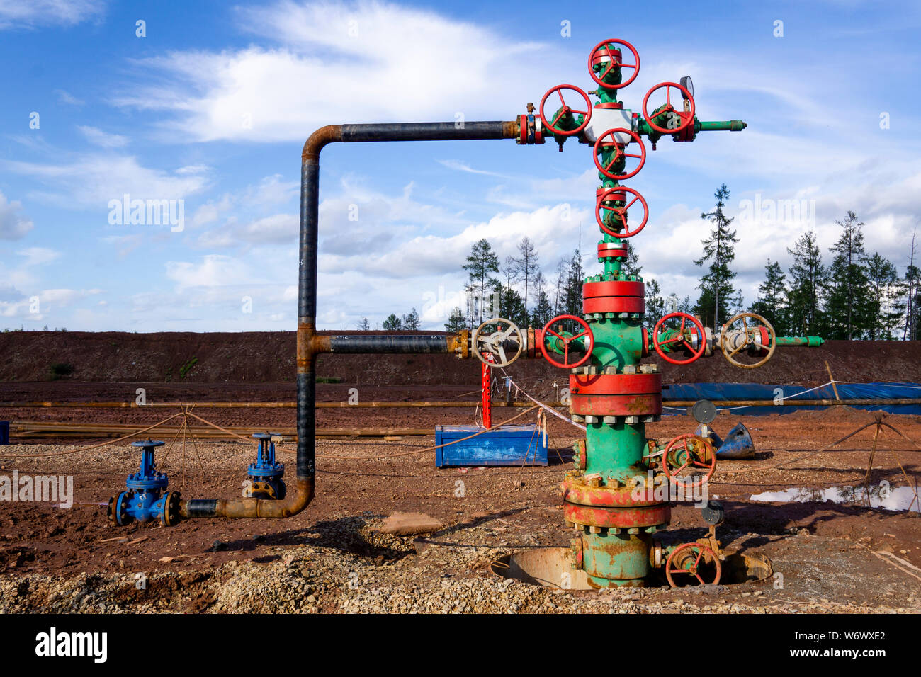 Horizontal view of a wellhead with valve armature. Oil and gas industry ...