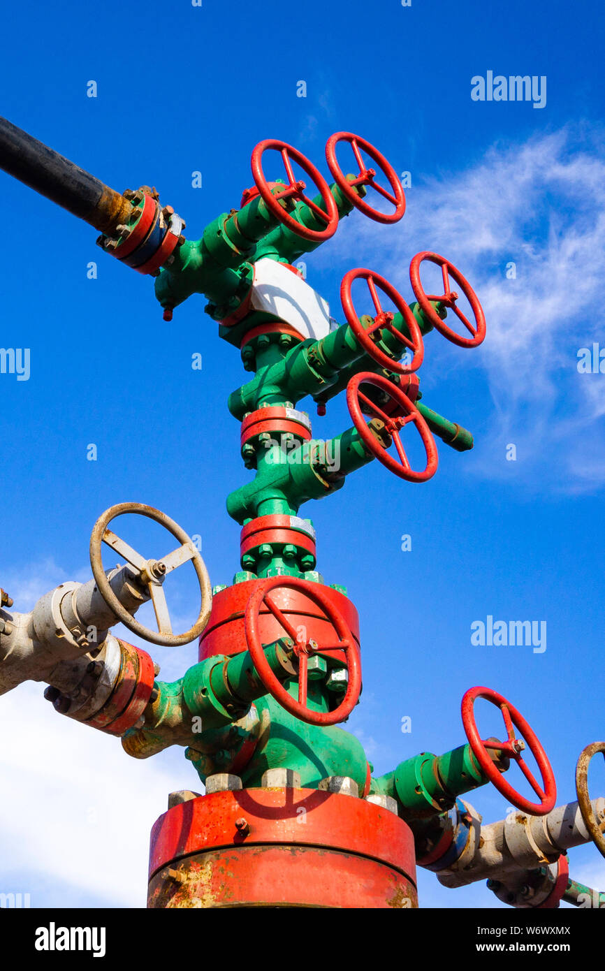 Horizontal view of a wellhead with valve armature. Oil and gas industry ...