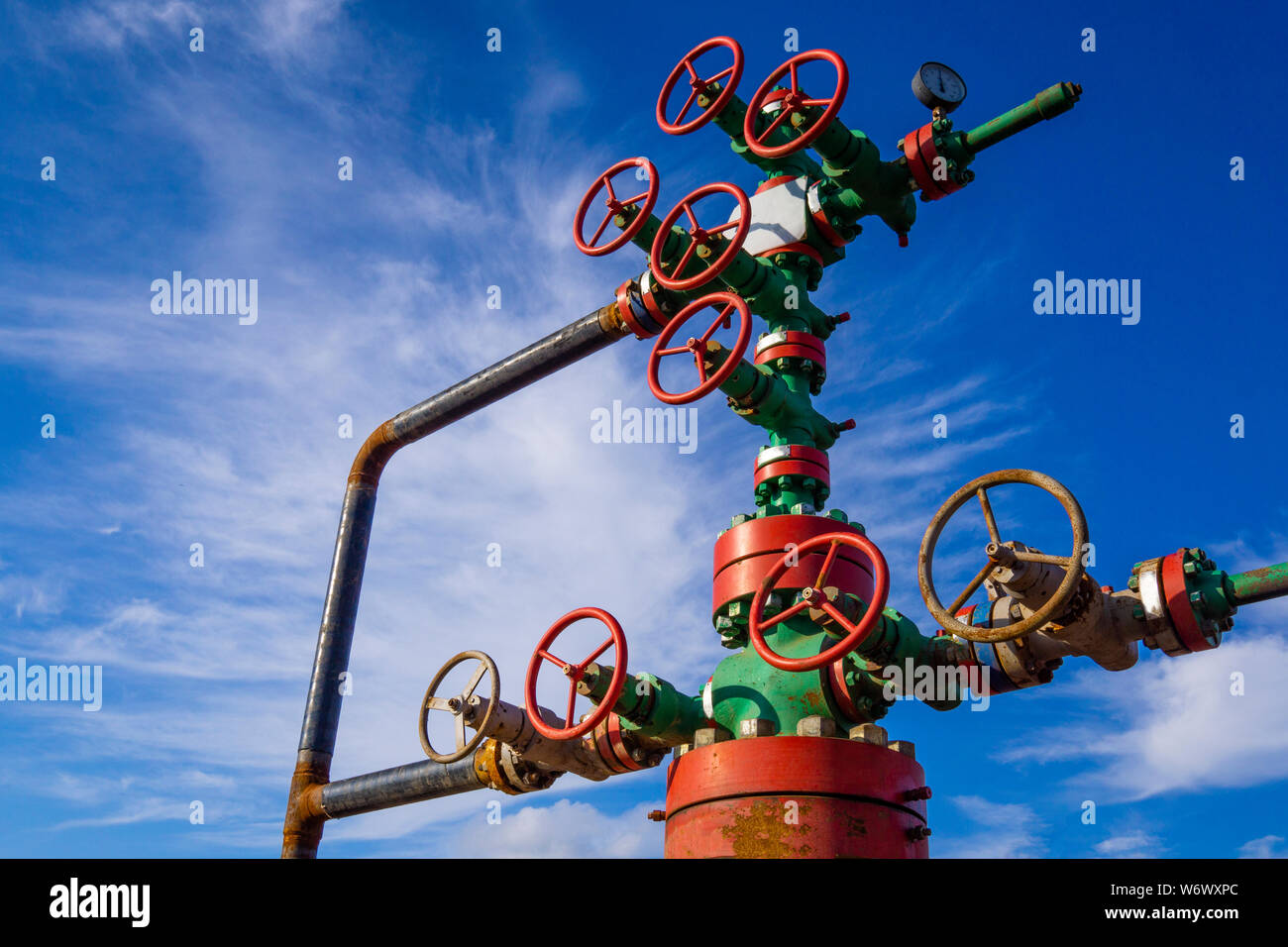 Horizontal view of a wellhead with valve armature. Oil and gas industry ...