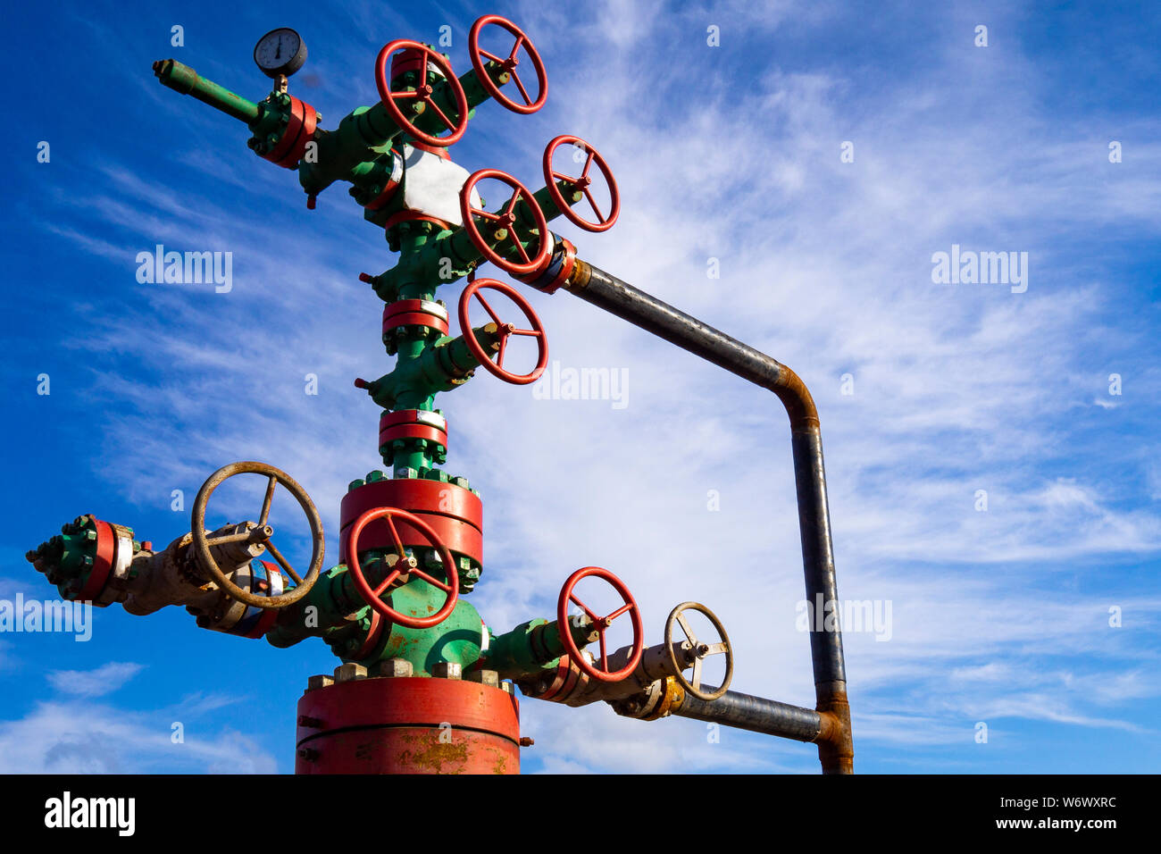 Horizontal view of a wellhead with valve armature. Oil and gas industry ...