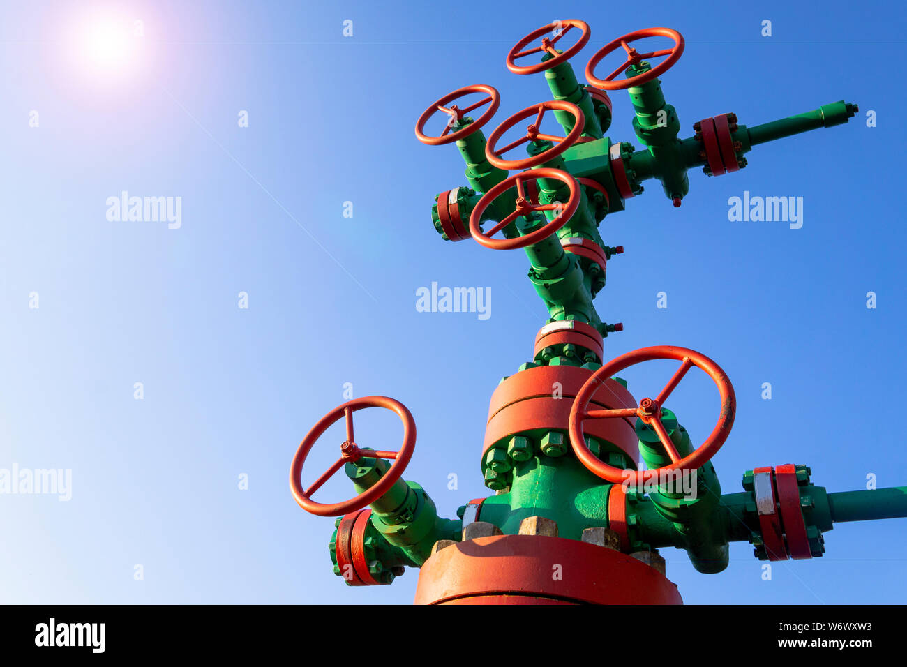 Horizontal view of a wellhead with valve armature. Oil and gas industry ...