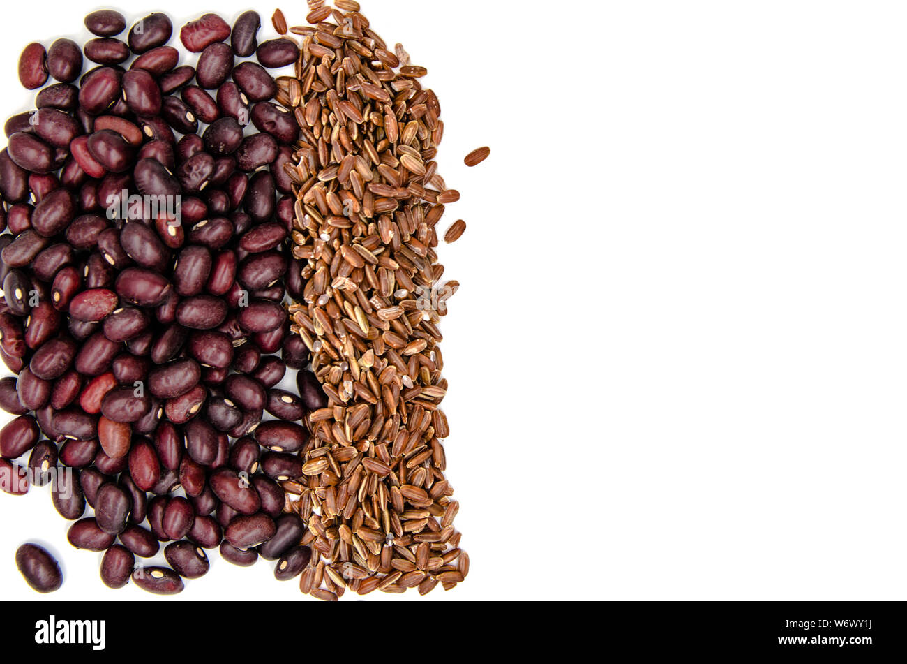 red beans and brown ruby rice on a white background with copy space ...