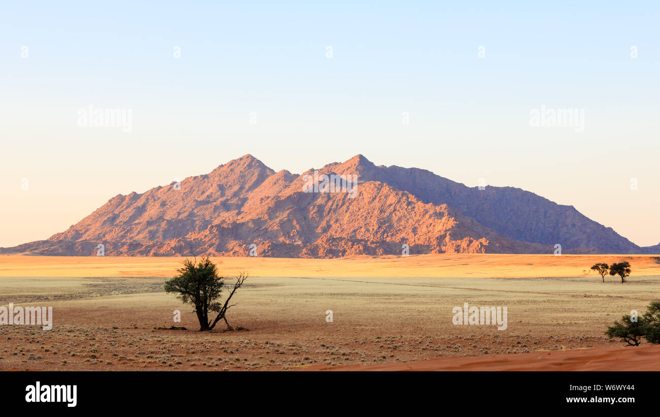 Red sand dunes and granite outcrops in Sesriem, Namibia Stock Photo - Alamy