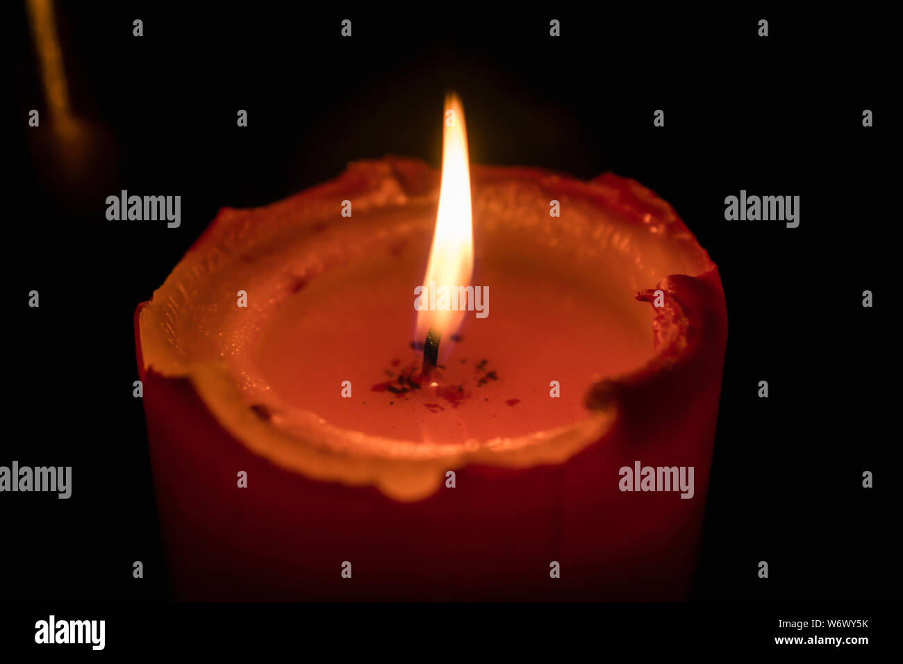 A close-up photo of a big red candle from above Stock Photo - Alamy