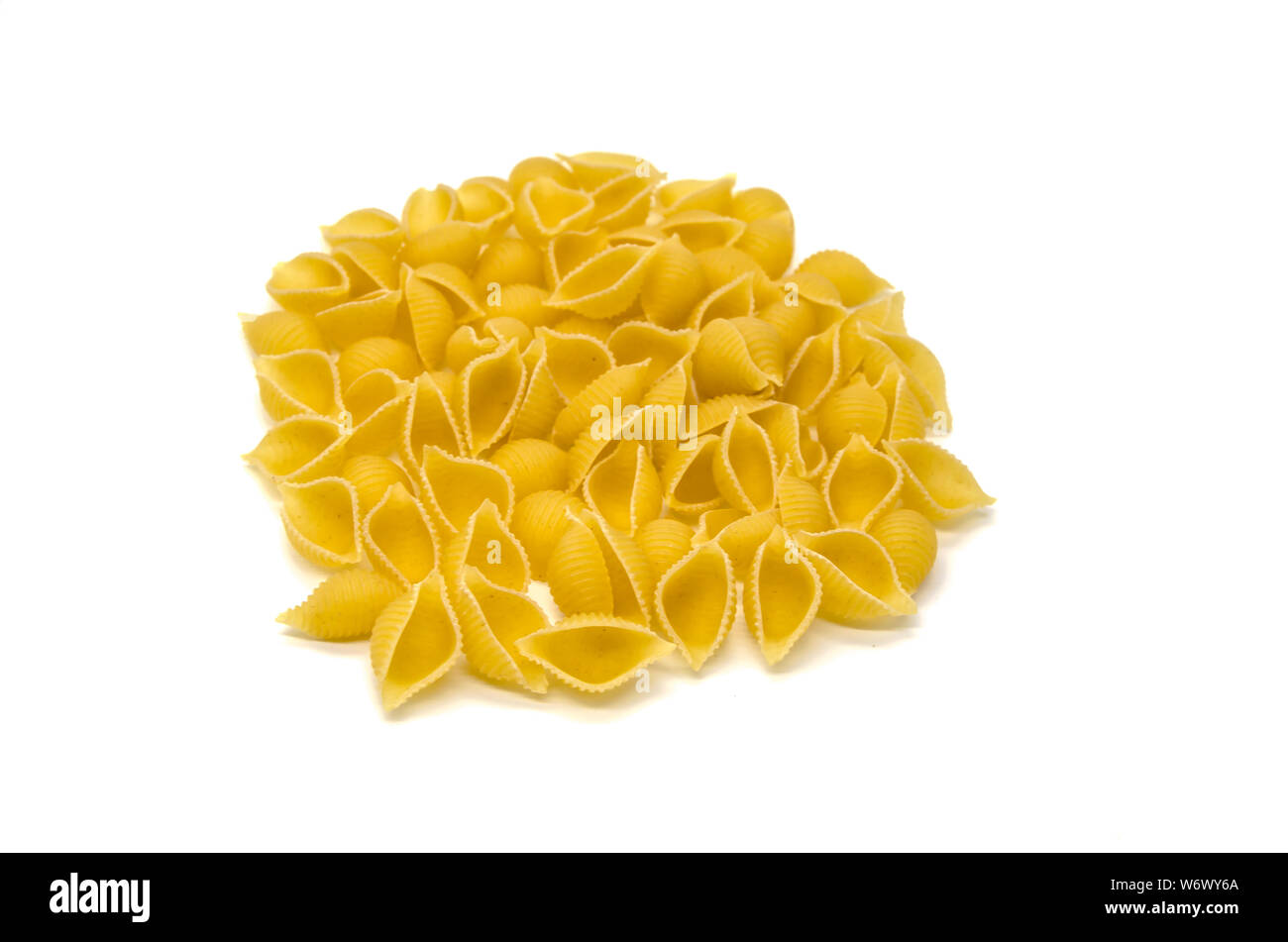 pasta conquilled on a white background isolated Stock Photo - Alamy