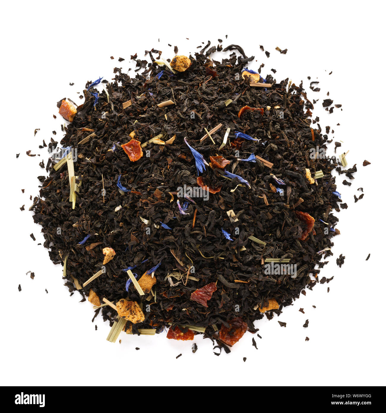 Dry black tea mixed with herbs, fruits and berries. Isolated on white ...