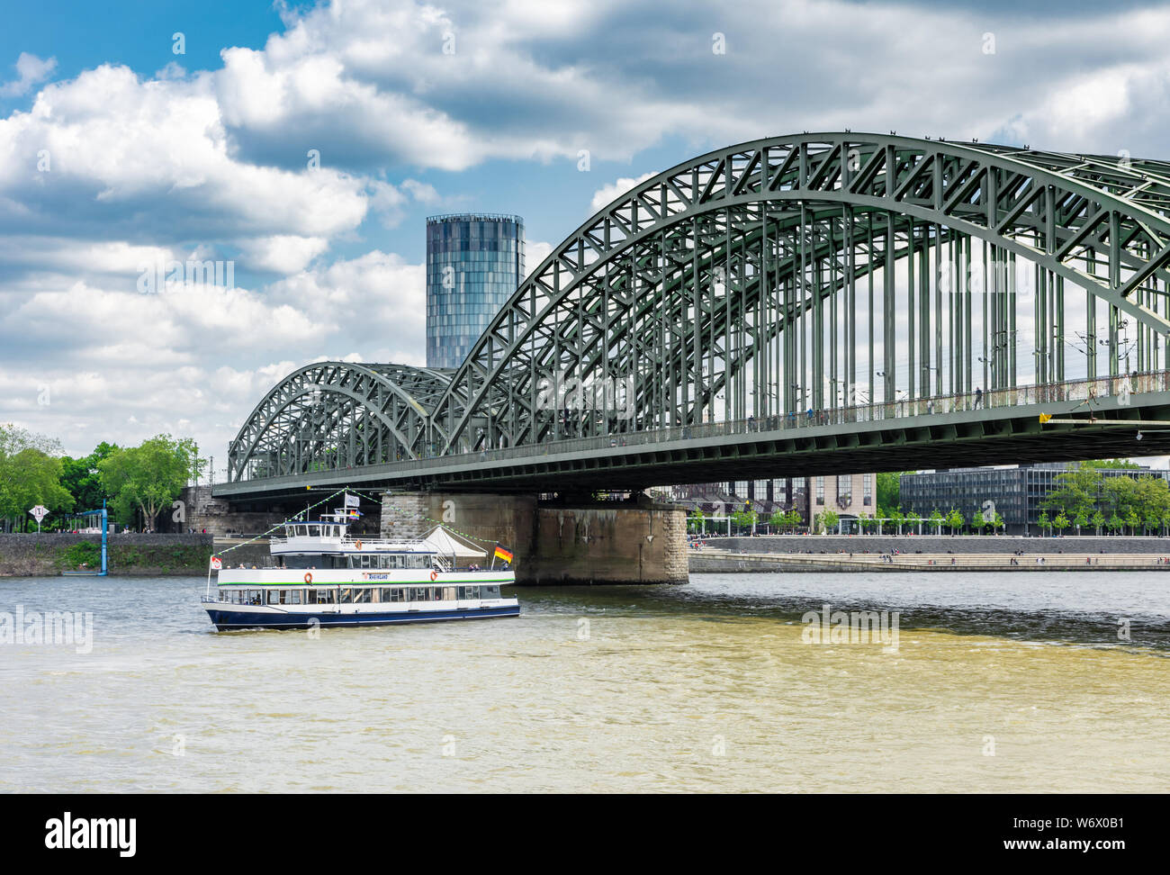 COLOGNE, GERMANY - MAY 12: Passenger ship crossing Hohenzollern bridge ...