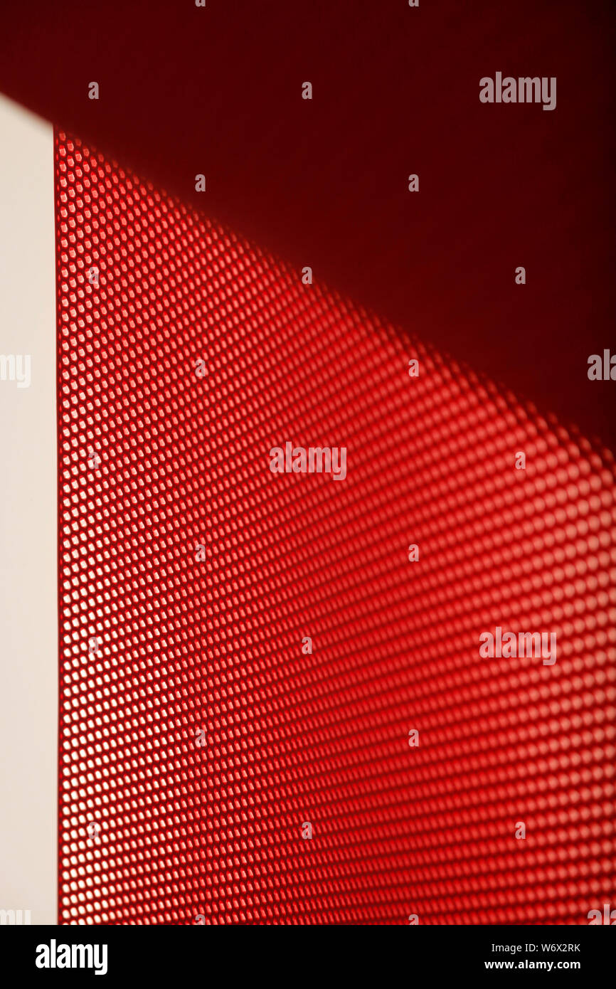 Colorful and perforated plastic grid Stock Photo - Alamy