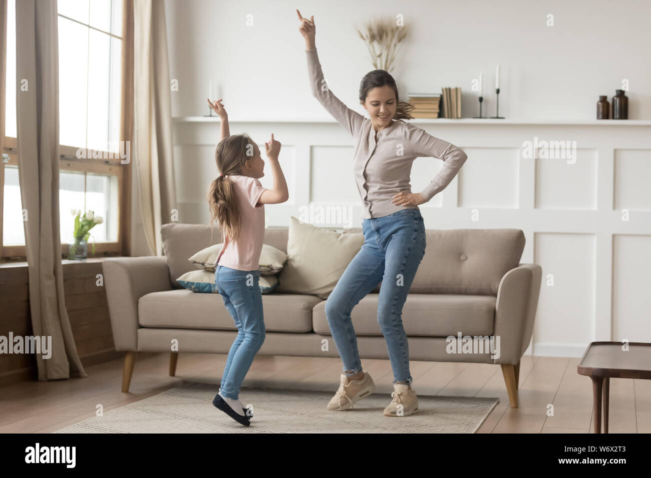 Active mother dancing at home with little daughter Stock Photo - Alamy