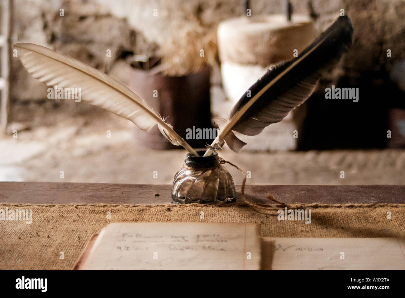 vintage writing table with pens and ink Stock Photo - Alamy
