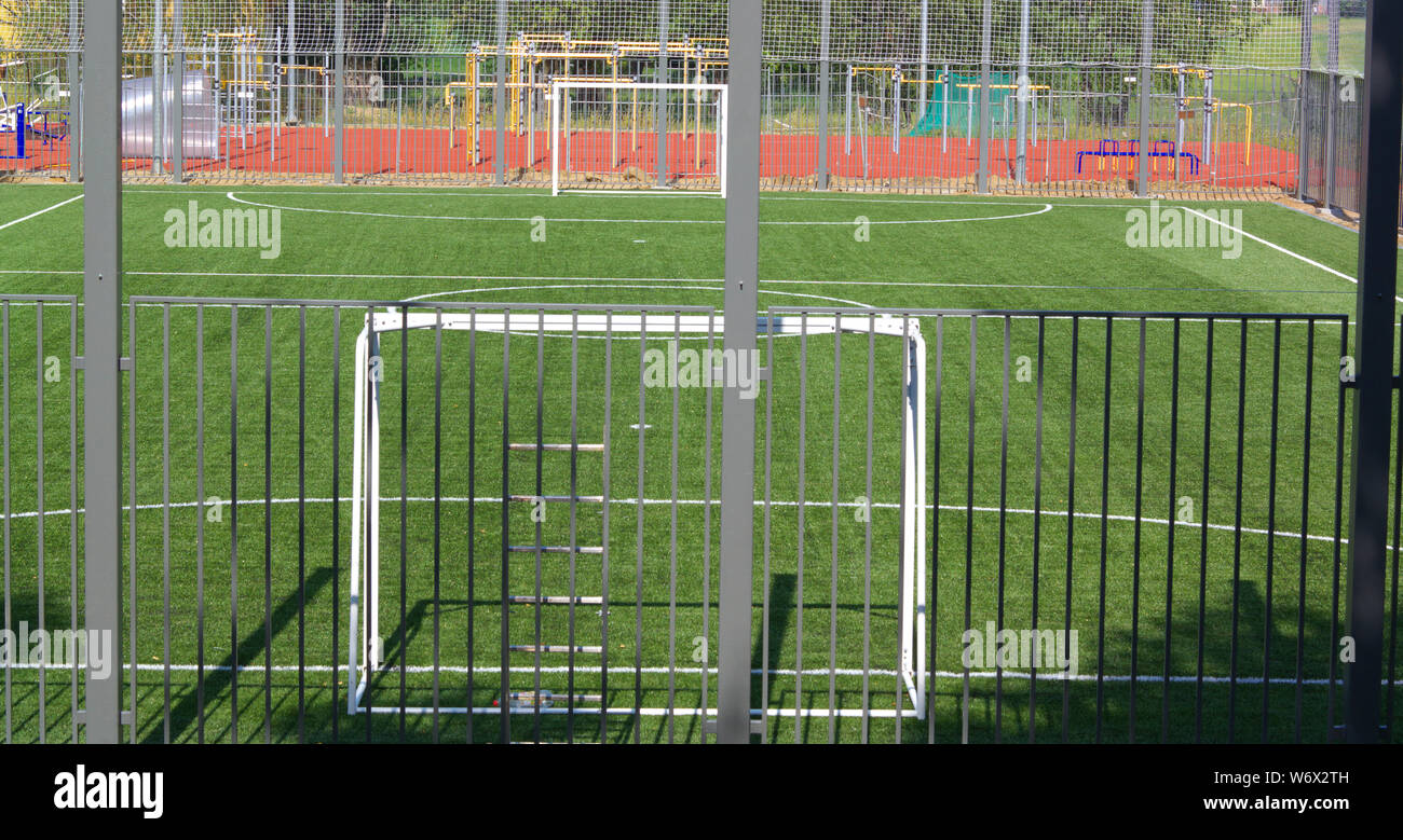 football field near fence at day sunny day Stock Photo - Alamy