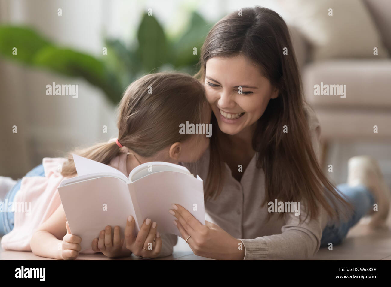 Woman daughter read book on hi-res stock photography and images - Alamy