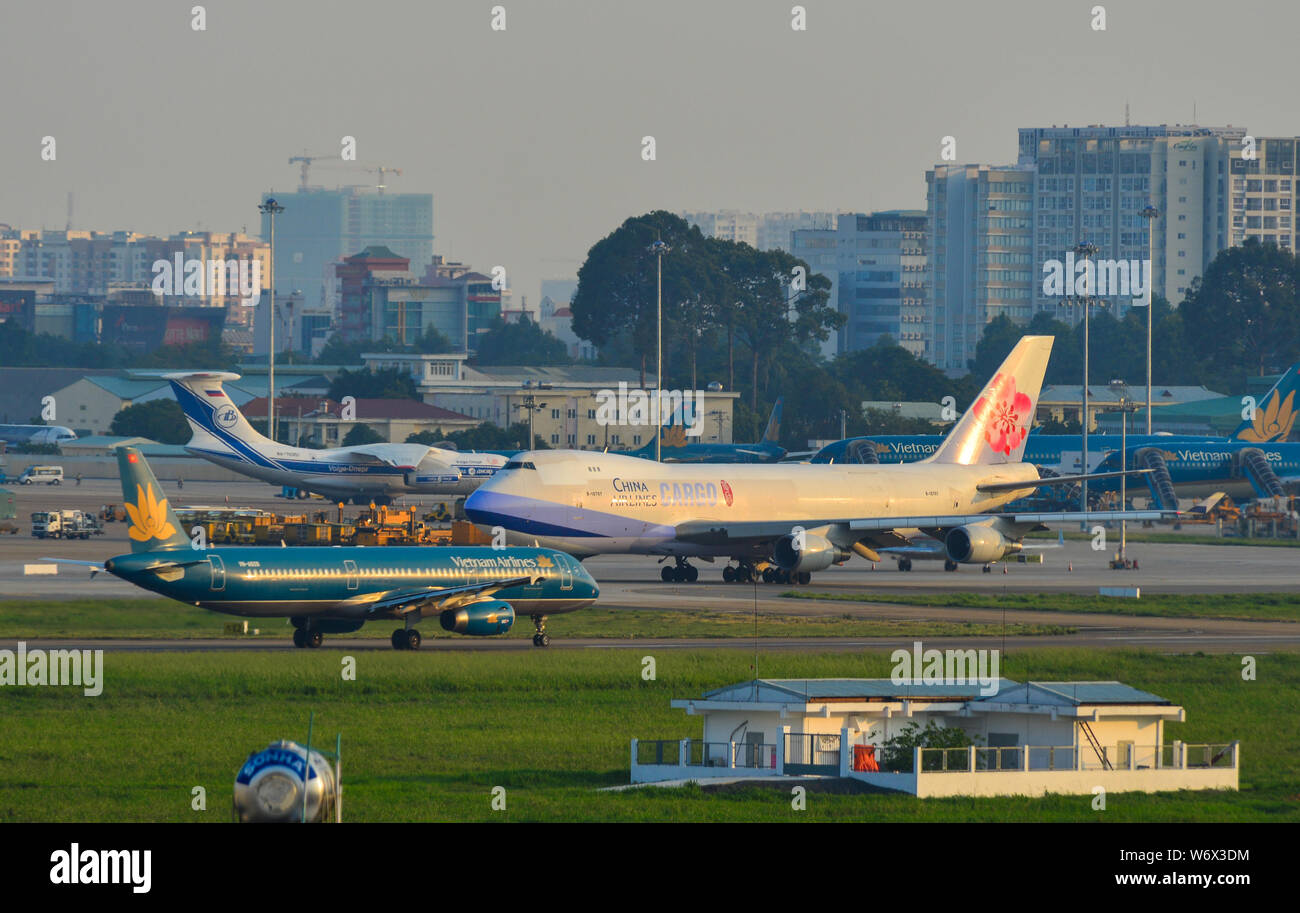 Saigon, Vietnam - Jul 10, 2019. Passenger airplanes taxiing on runway ...