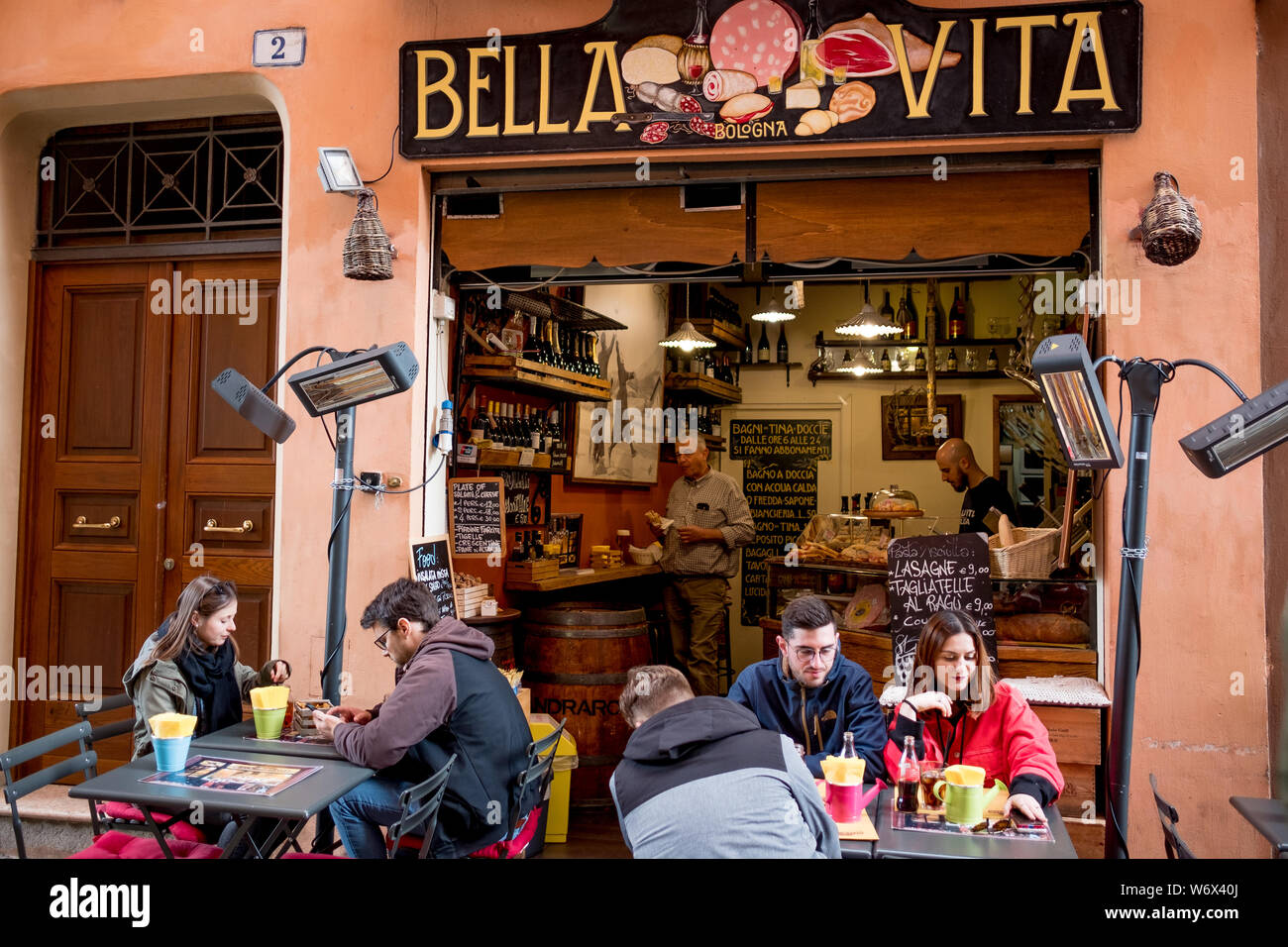 Bologna, Italy - 20 may 2019: locals and tourist eat outside ...