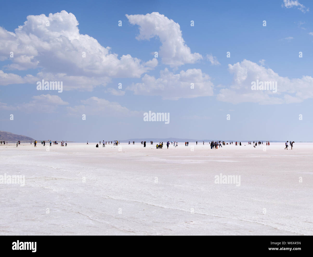 Turkey: people in the distance walking on the salt expanse of Lake Tuz ...