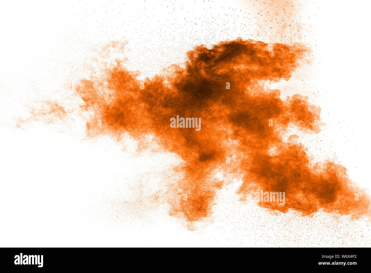 Abstract orange dust explosion on white background. Abstract orange ...