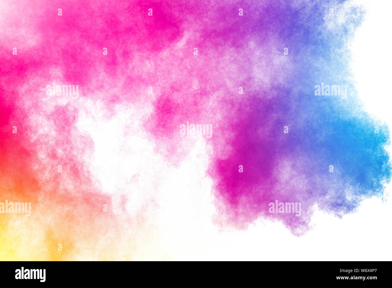 Abstract multi color powder explosion on white background.Freeze motion ...