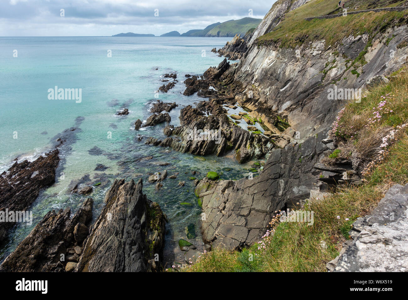 Rugged outcrops on sea cliffs at Dunmore Head on the Dingle Peninsula ...