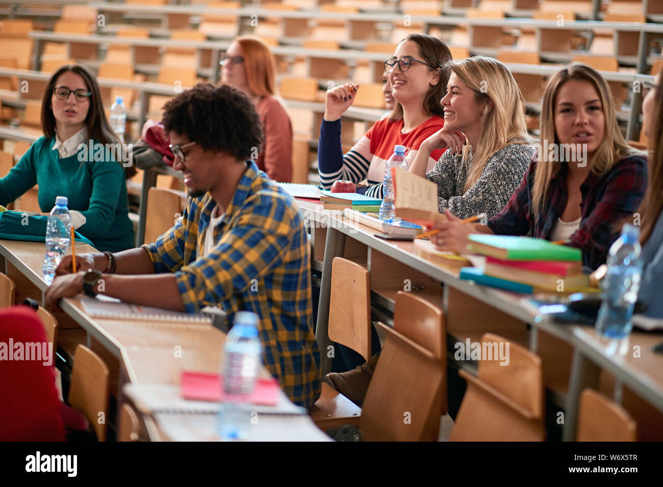 young students spending time together at college on auditorium Stock ...