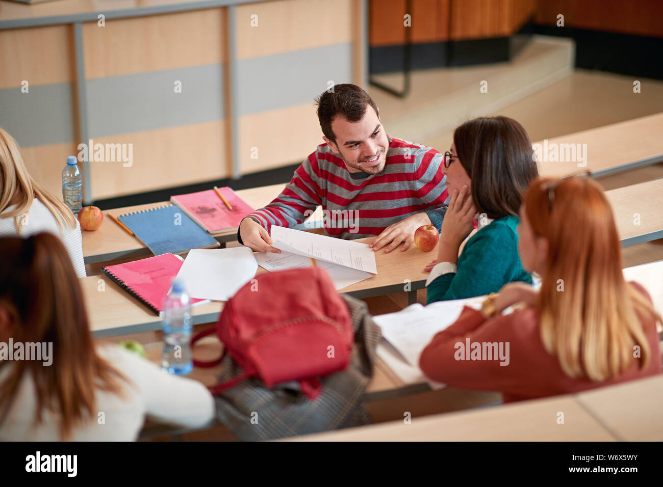 Group of young students in an exam in a classroom Stock Photo - Alamy