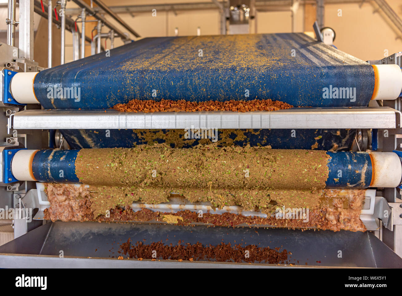 Machine squeezes apples and apple pomace remain as press residues Stock ...