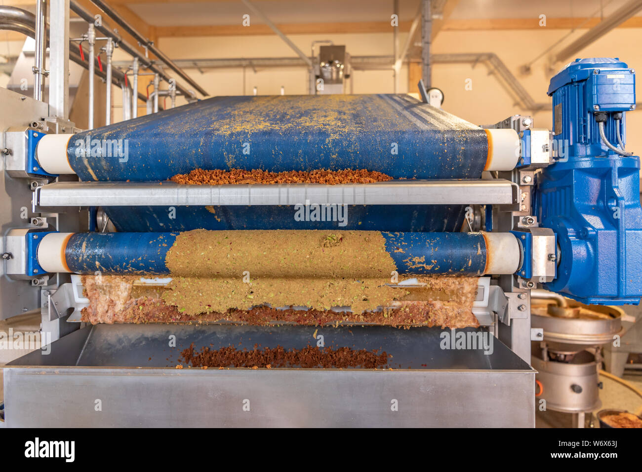 Machine squeezes apples and apple pomace remain as press residues Stock ...