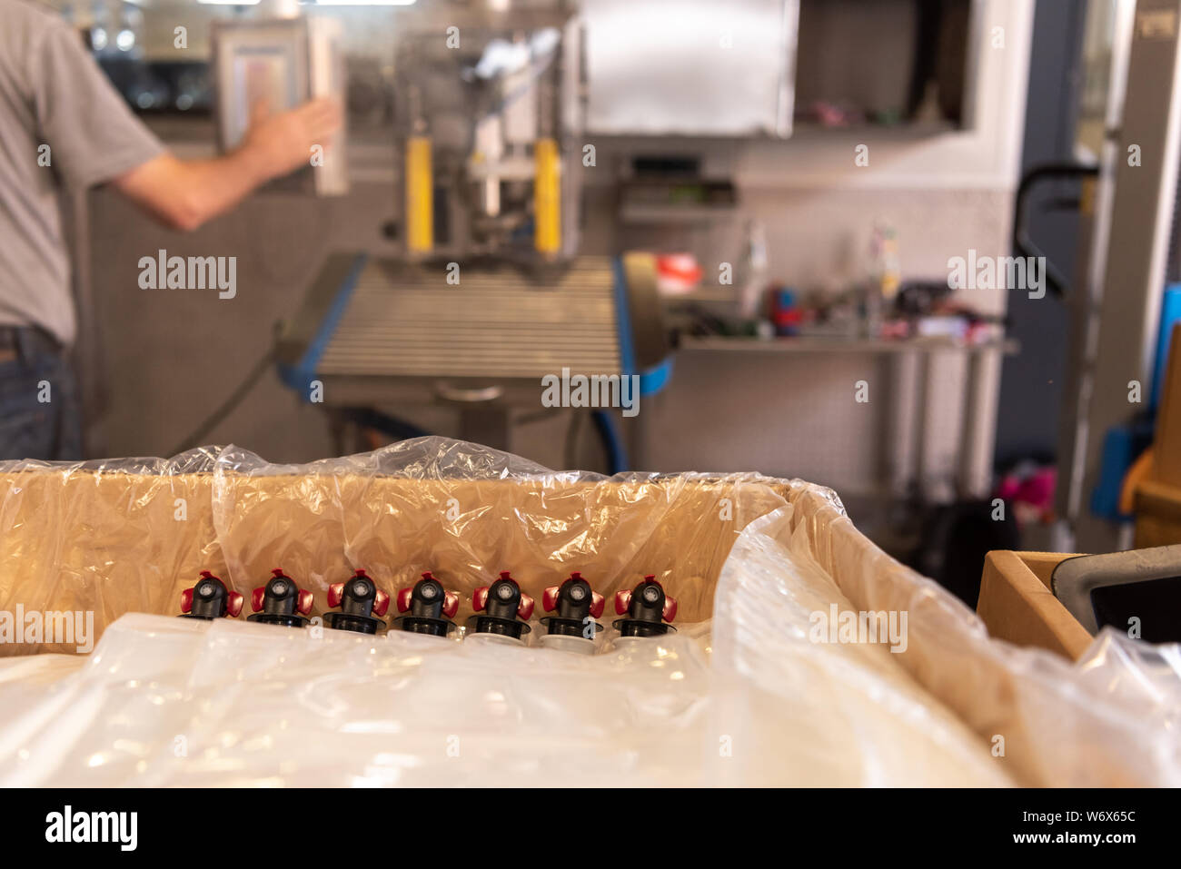 A box full of plastic bags for filling bag in box juice Stock Photo - Alamy