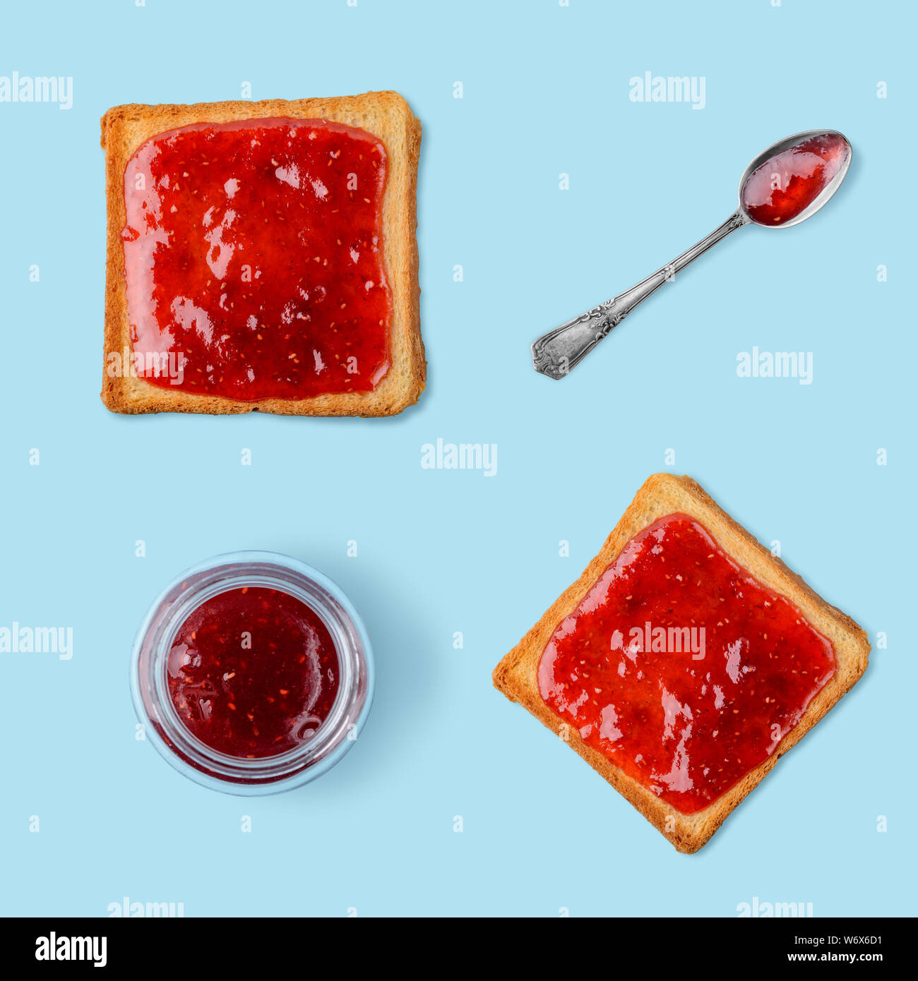 Toast with raspberry jam Stock Photo - Alamy