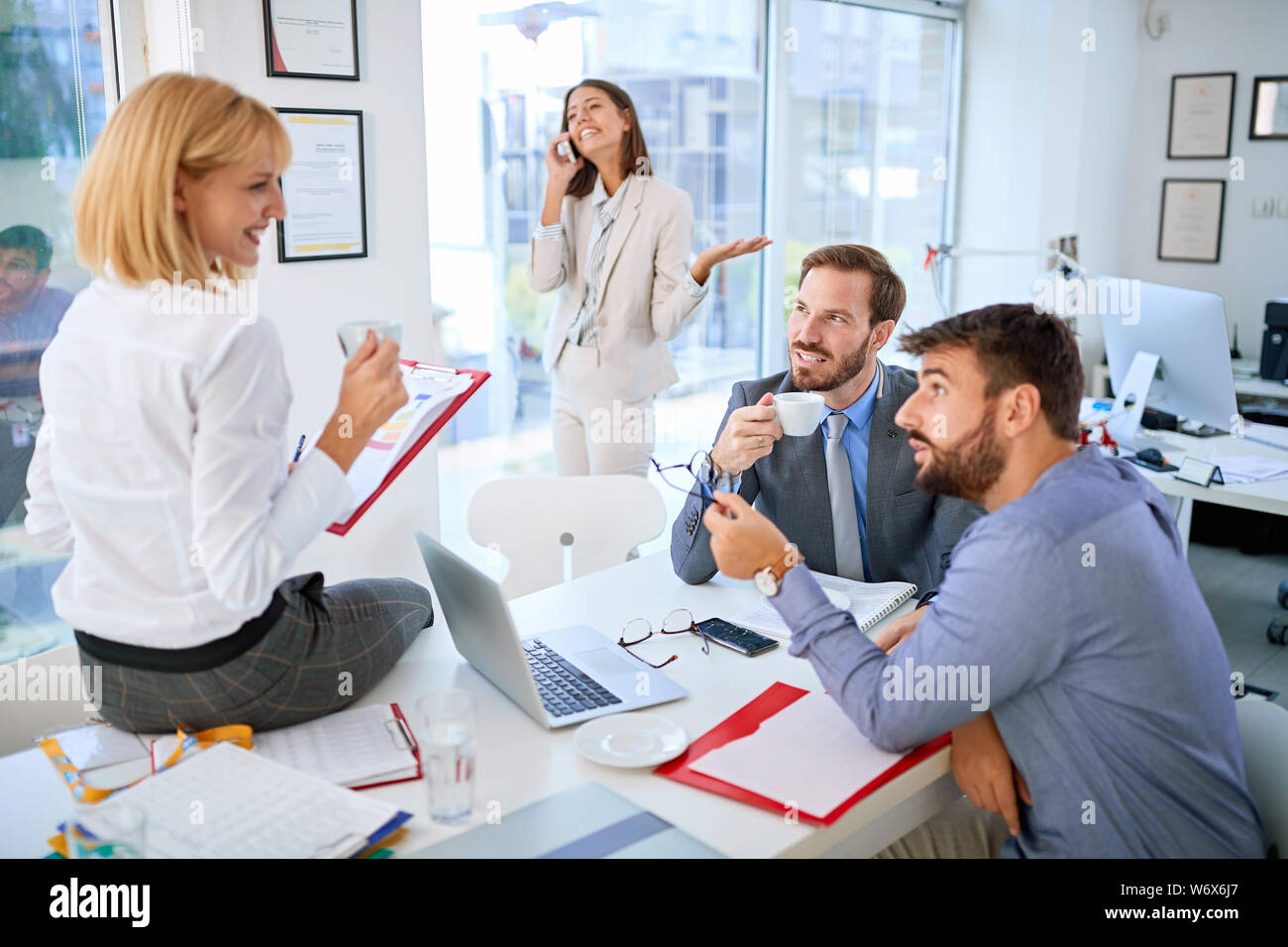 Group happy colleagues communicating hi-res stock photography and ...