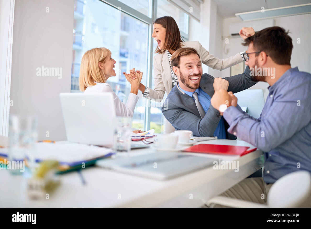 Happy office colleagues successfully hi-res stock photography and ...