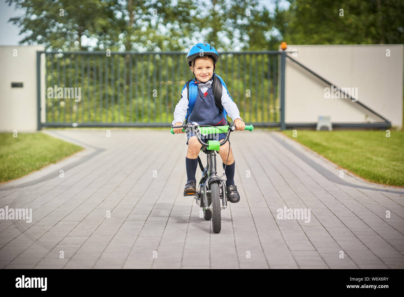 Boy bike helmet backpack hi-res stock photography and images - Alamy
