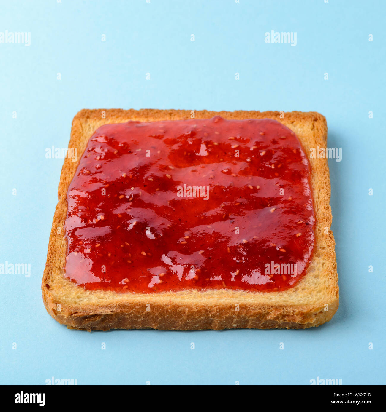 Toast with raspberry jam Stock Photo - Alamy