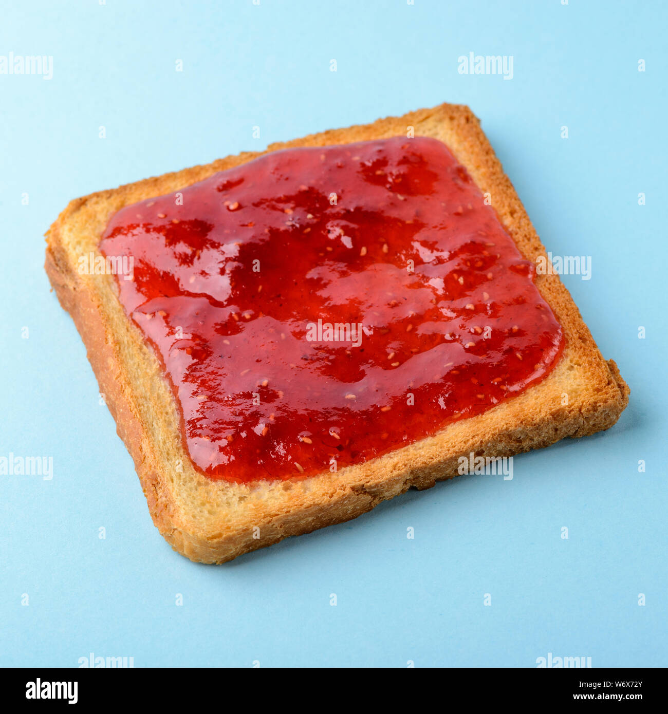 Toast with raspberry jam Stock Photo - Alamy