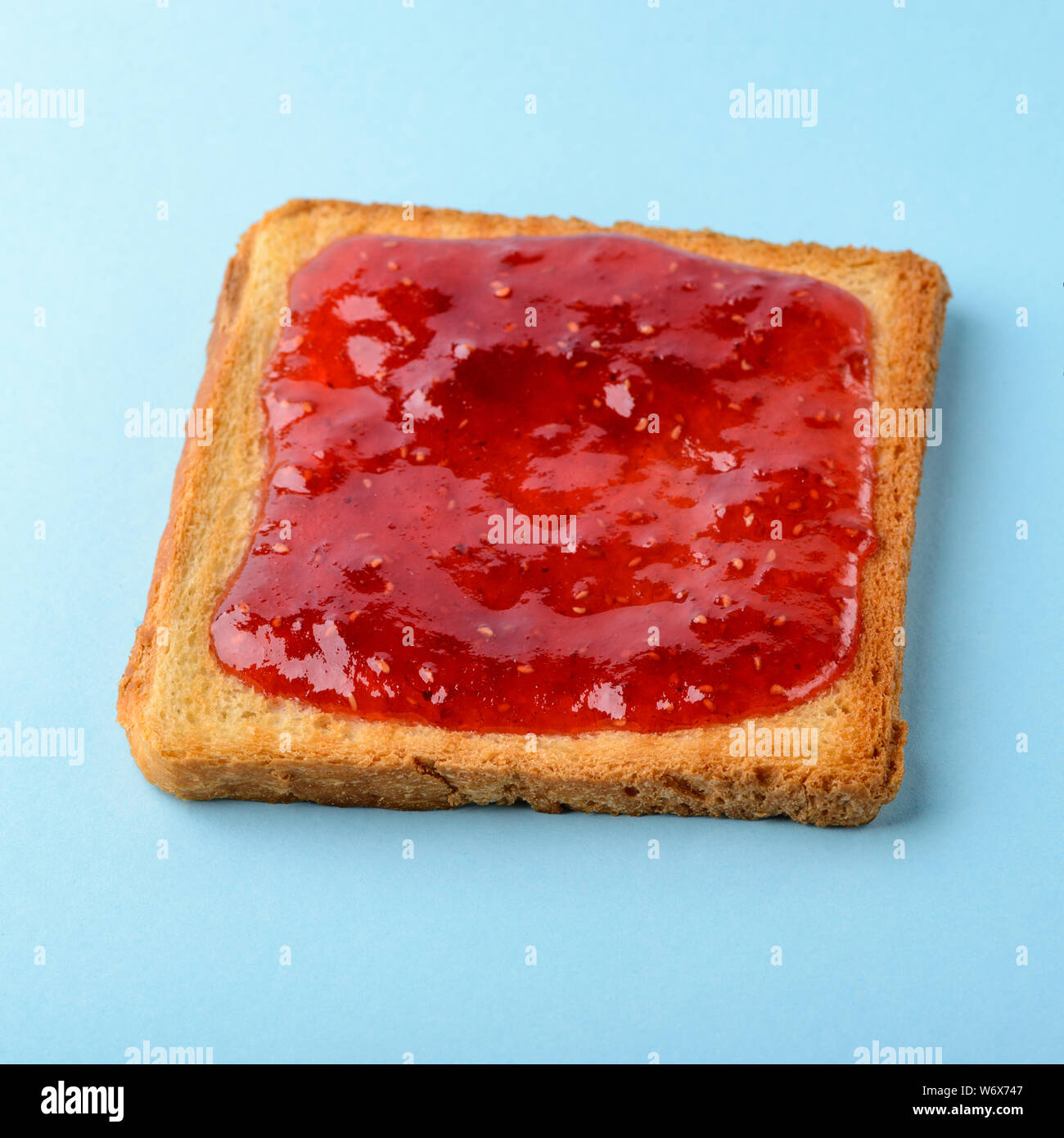 Toast with raspberry jam Stock Photo - Alamy