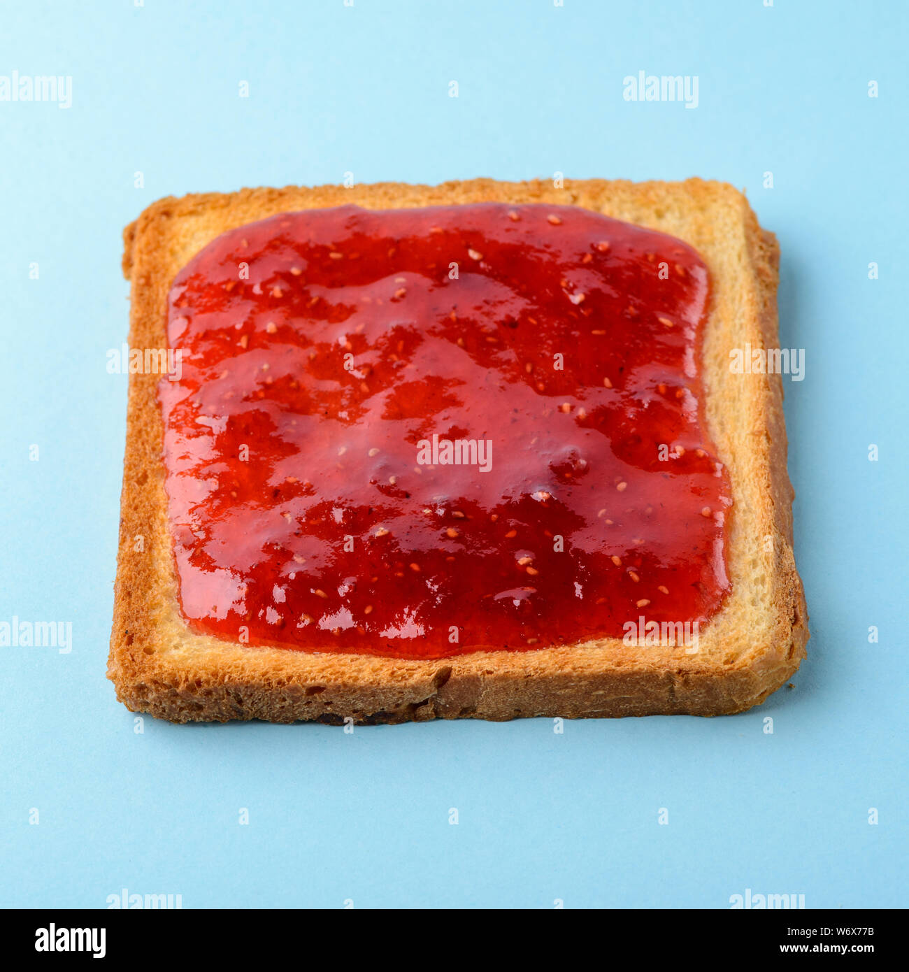Toast with raspberry jam Stock Photo - Alamy