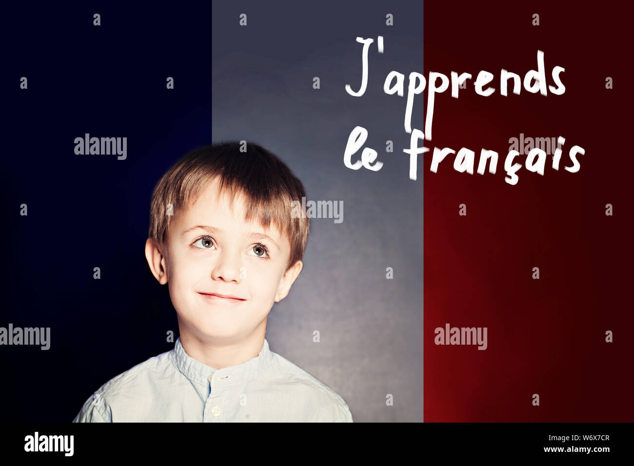 Learn french language concept. Happy child student pointing up on the ...