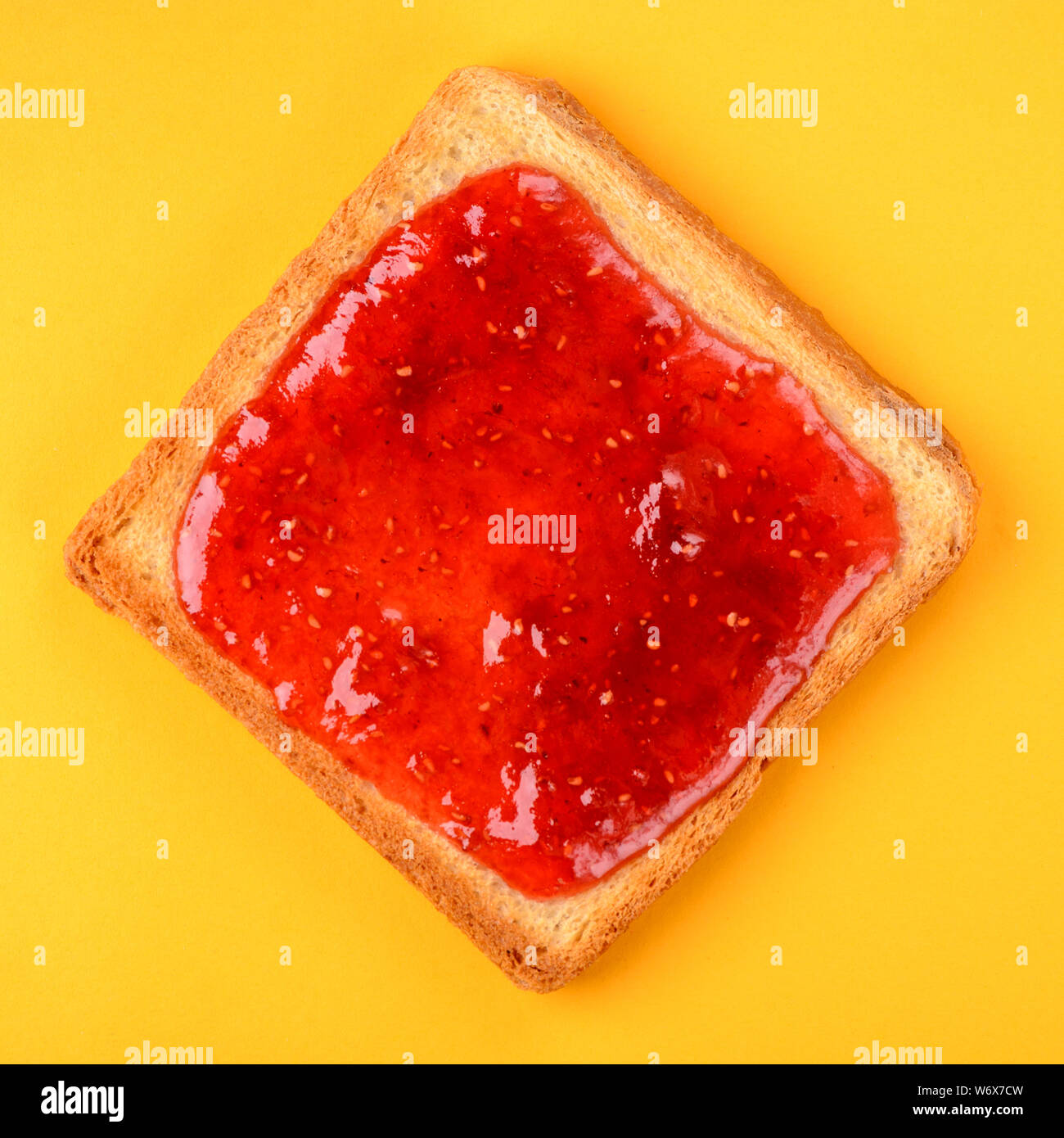Toast with raspberry jam Stock Photo - Alamy