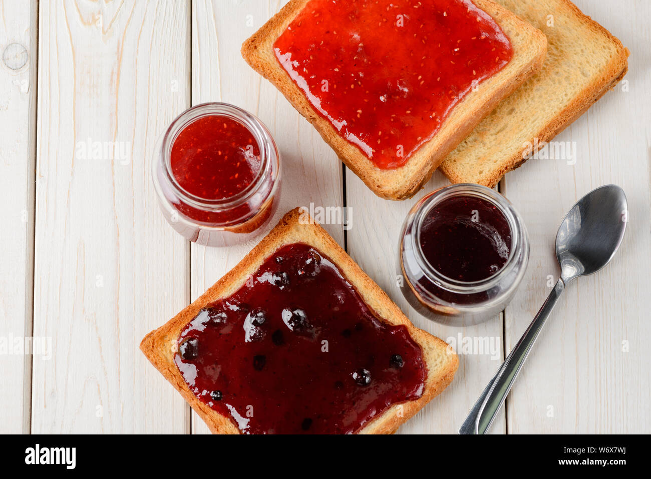 Toasted bread with spread jam Stock Photo - Alamy
