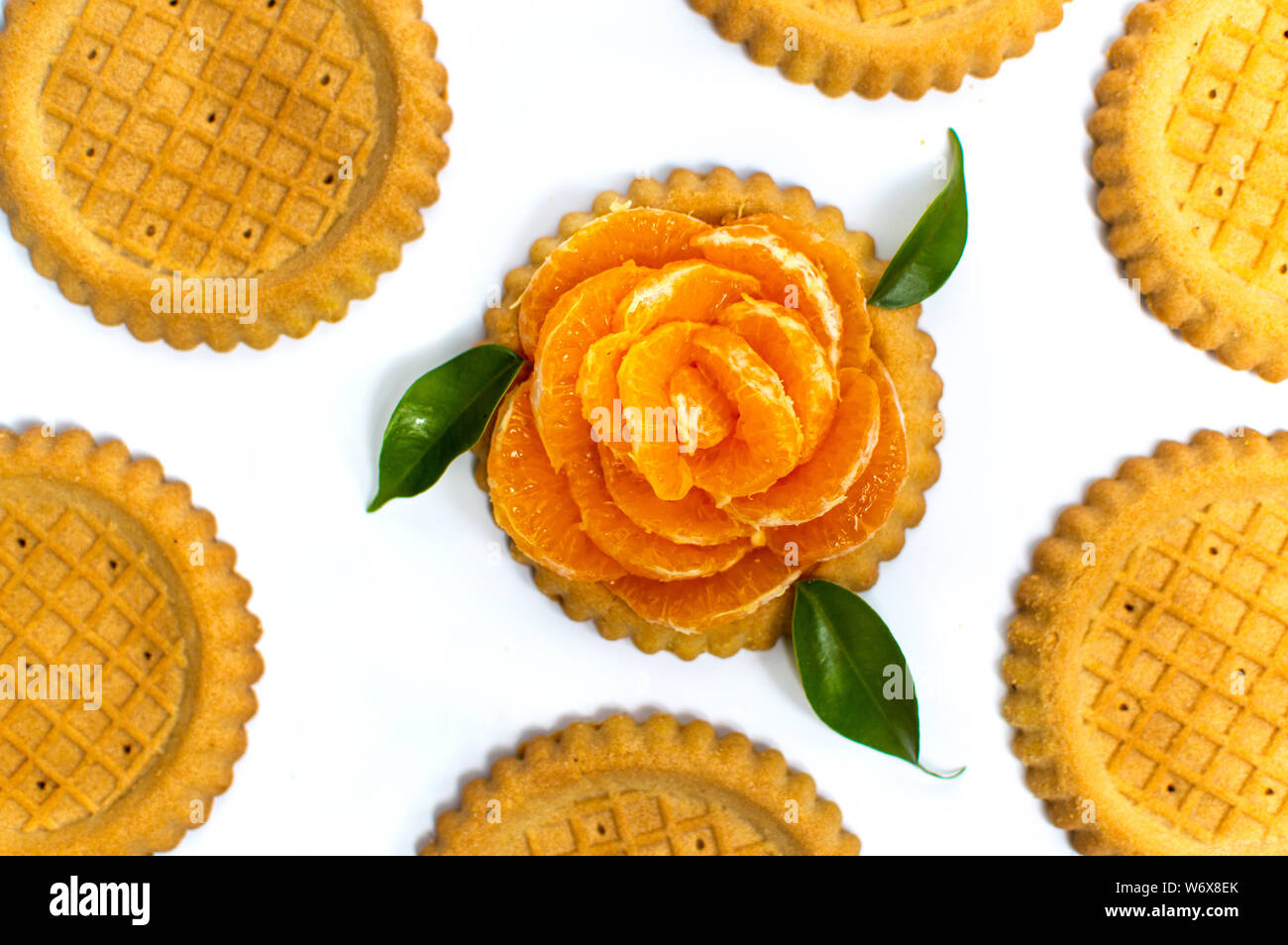 Golden biscuits with orange isolated on white background Stock Photo ...