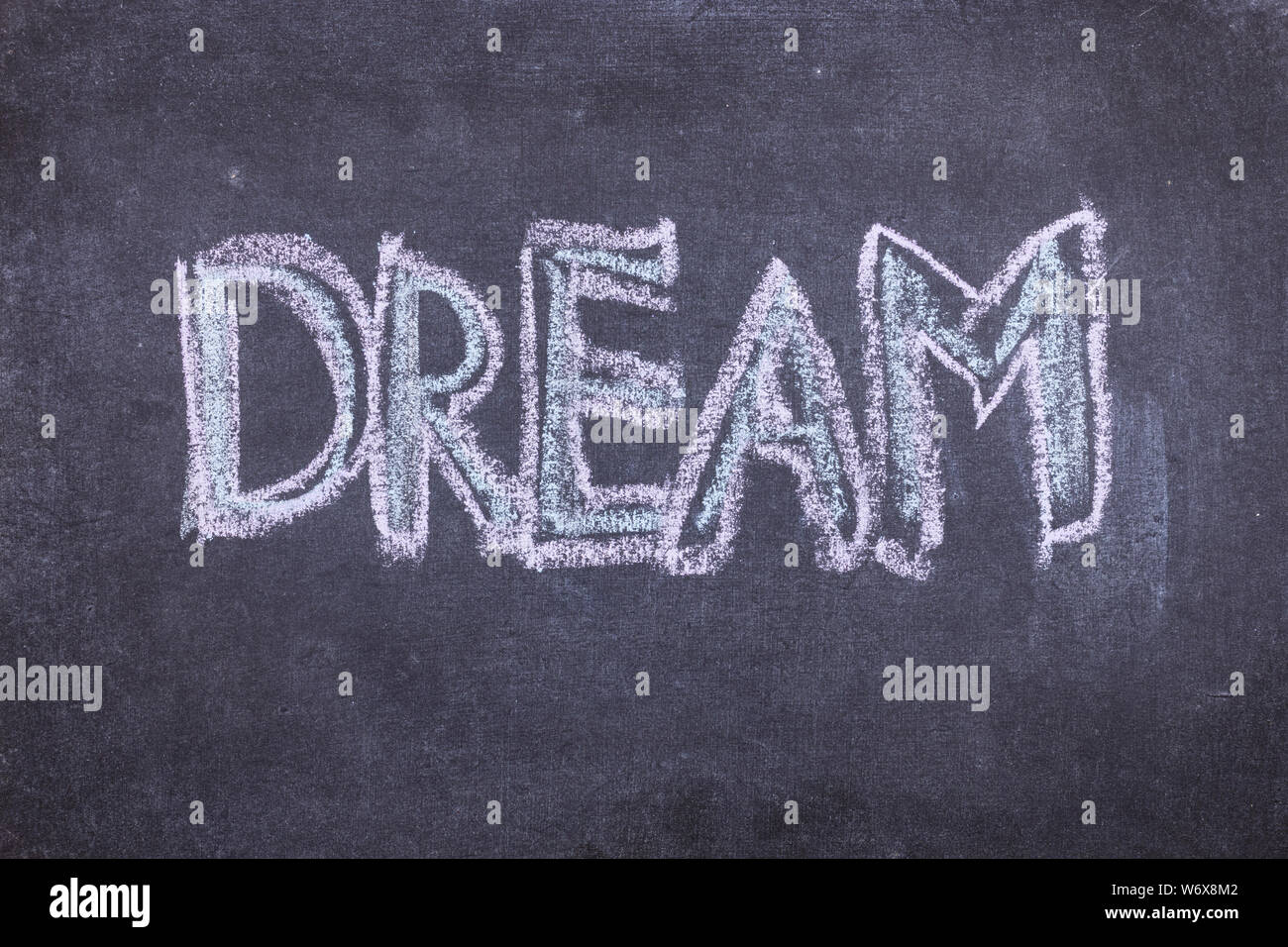 Dream. Chalk lettering on blackboard. Multi colored inscription on a ...