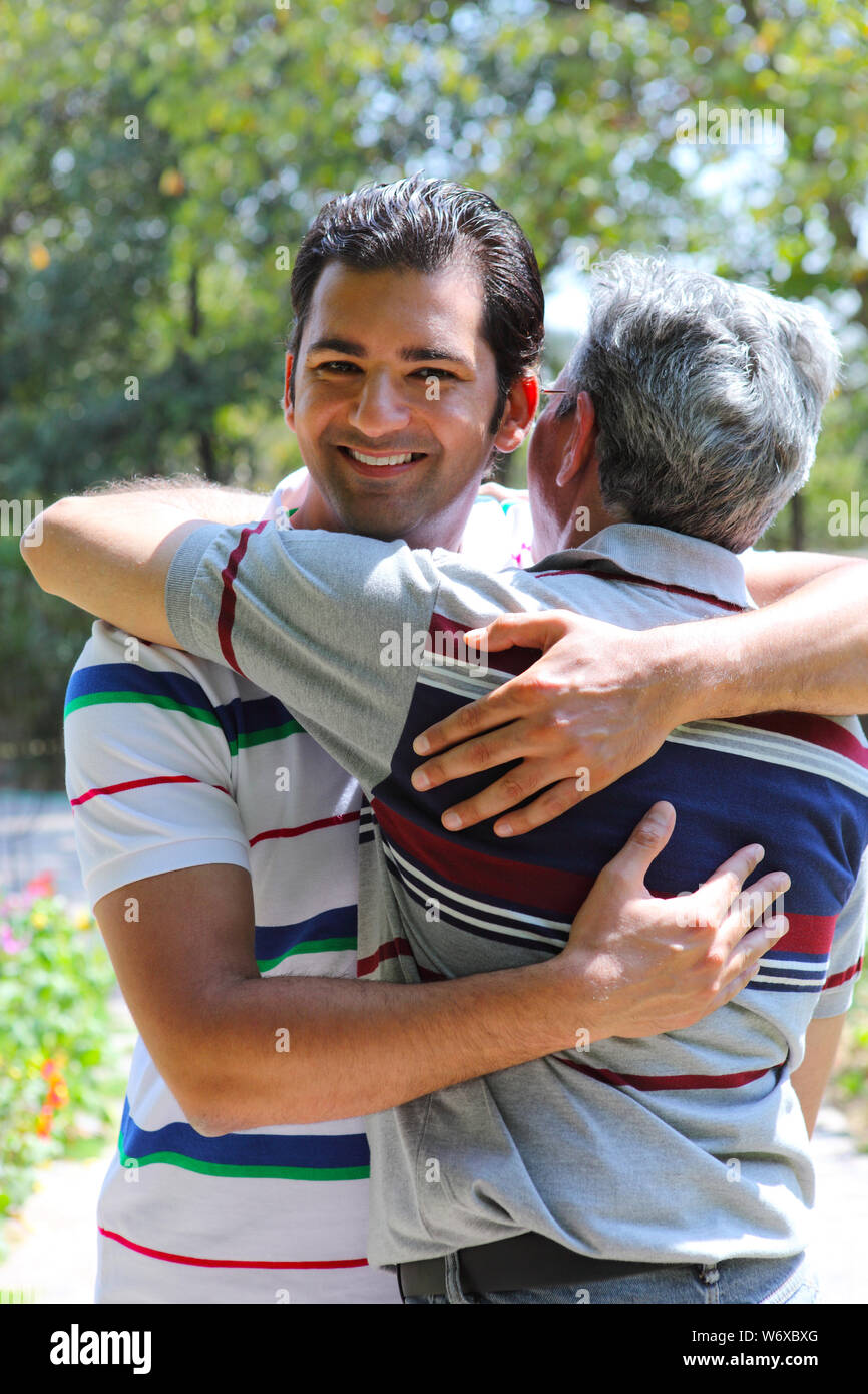 Indian men hugging hi-res stock photography and images - Alamy