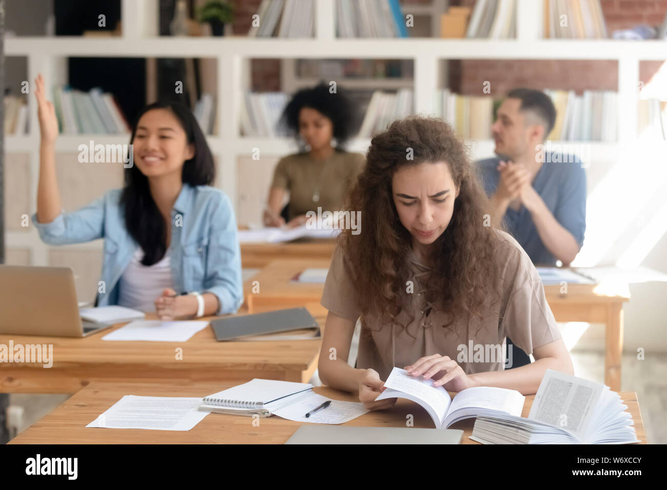 Diverse girls and guys students sitting in class during lecture Stock ...