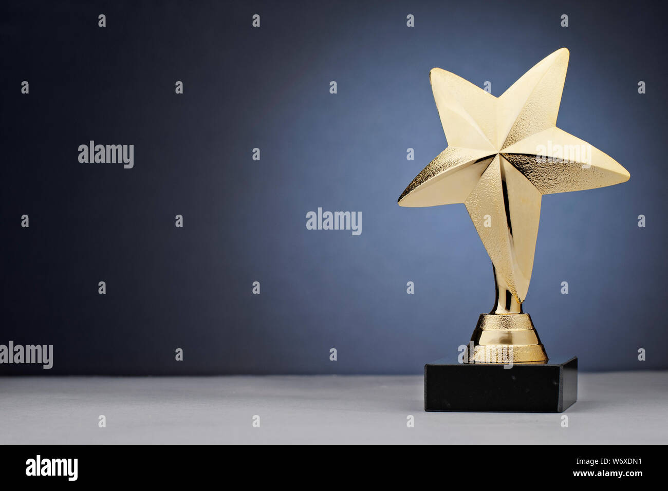 Golden shiny trophy for victory in competition in star shape Stock ...