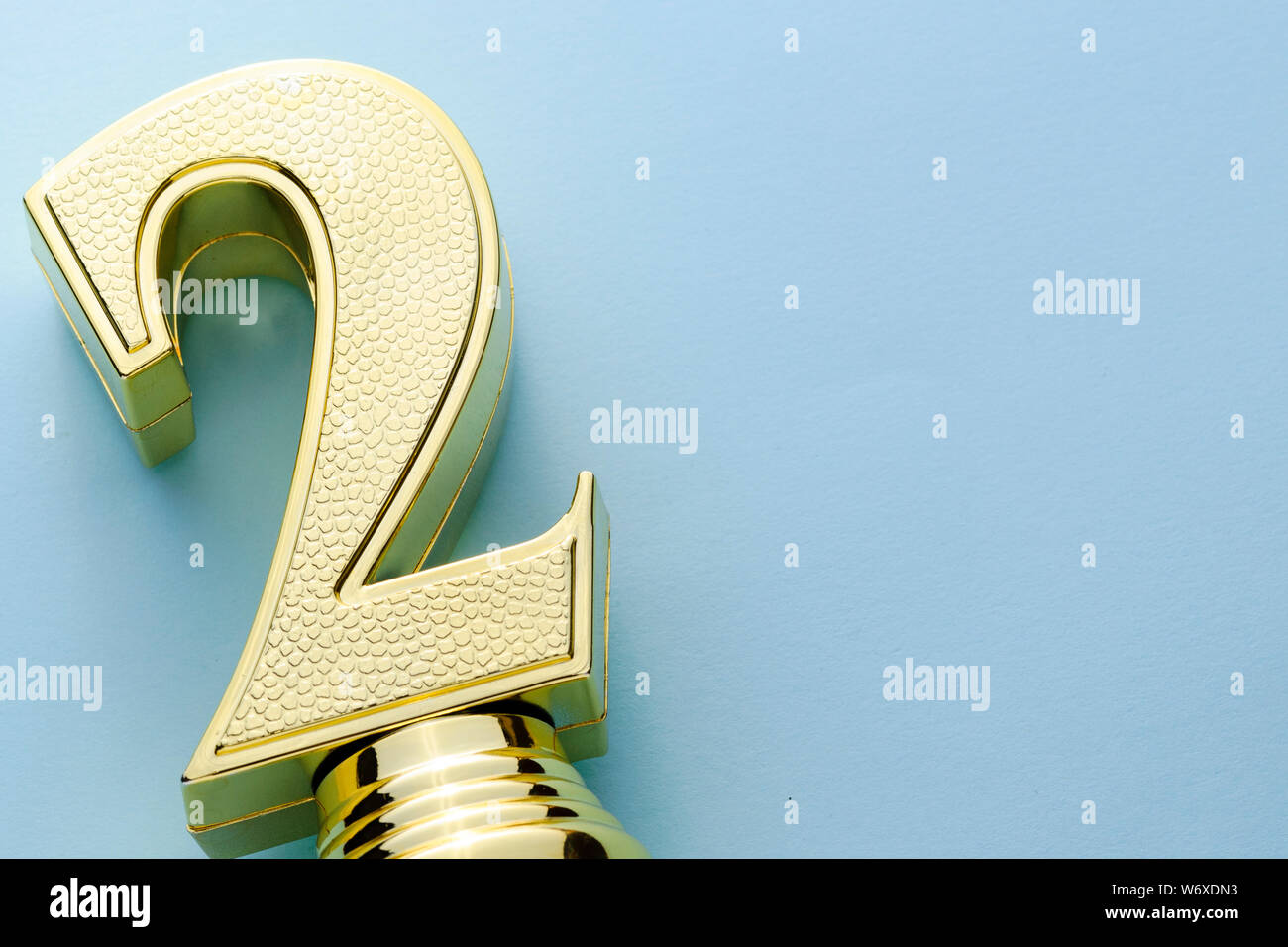 Detail of a gold second place winners trophy in the form of a ... Detail of a gold second place winners trophy in the form of a ...