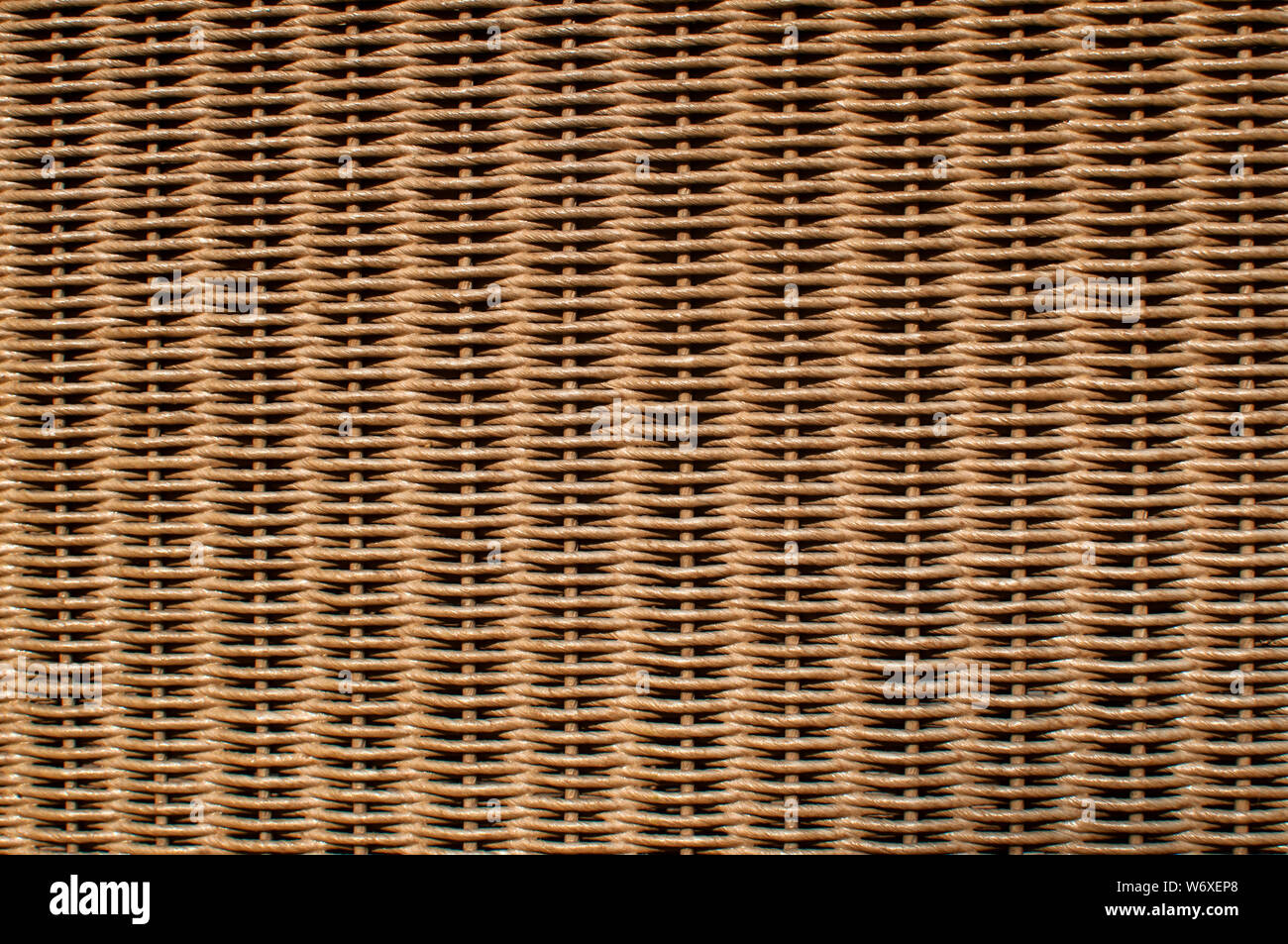 Natural brown rattan woven furniture surface closeup as background ...