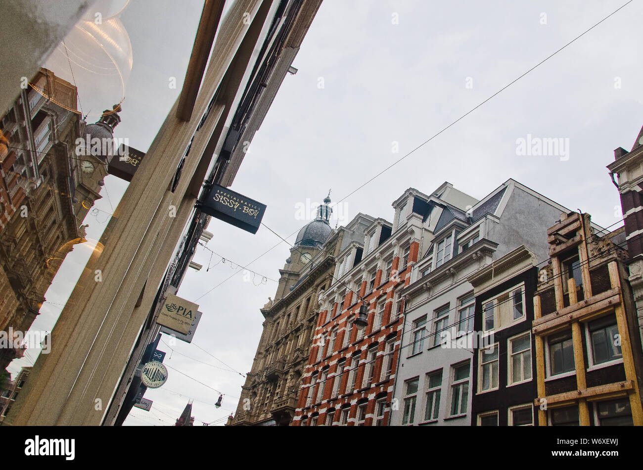 The reflection of the Amsterdam street in the shop window Stock Photo ...