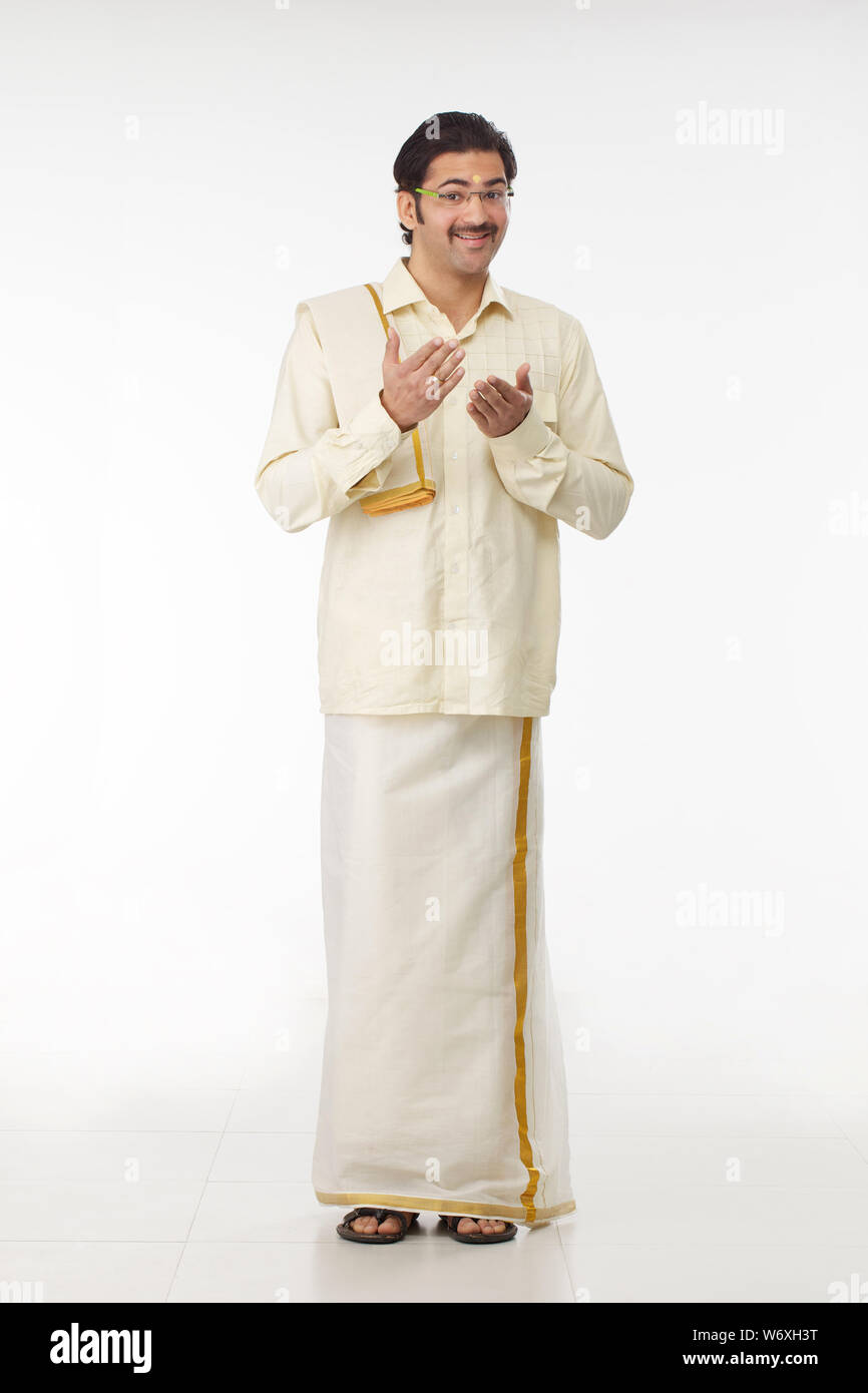 South Indian man standing and gesturing Stock Photo - Alamy