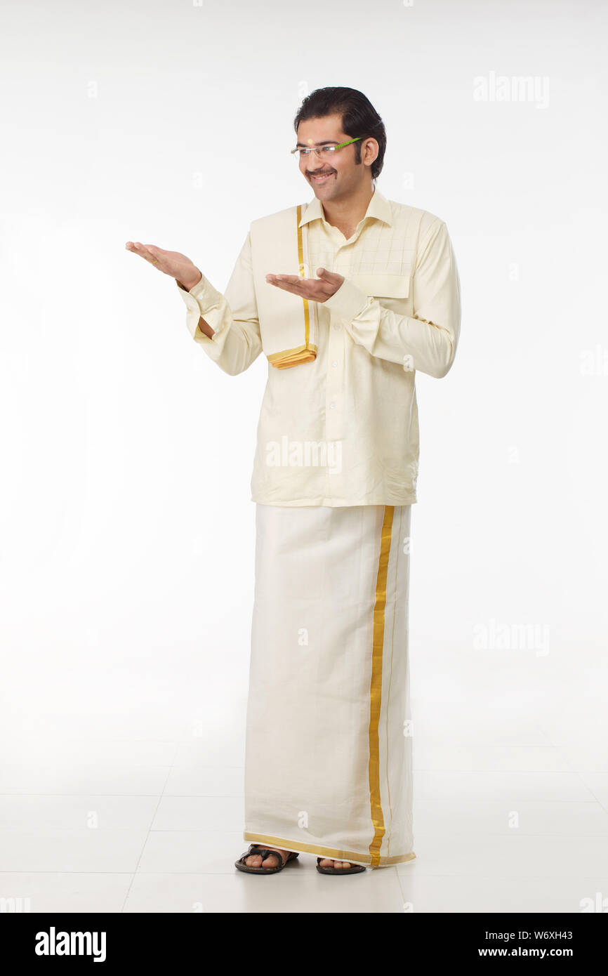 South Indian man standing and gesturing Stock Photo - Alamy