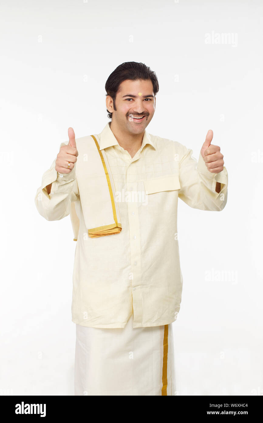 South Indian man showing thumbs up signs Stock Photo - Alamy
