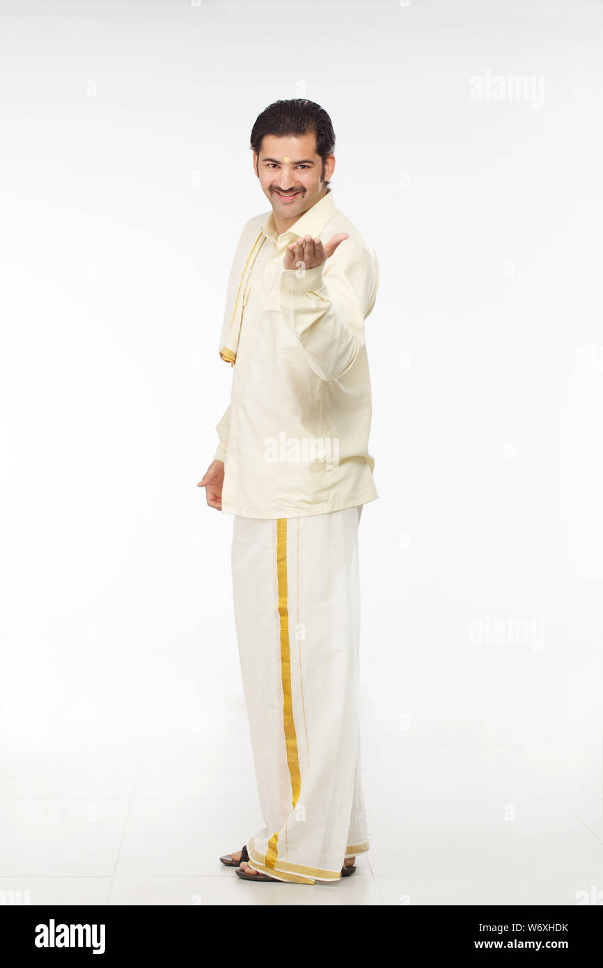 South Indian man standing and gesturing Stock Photo - Alamy